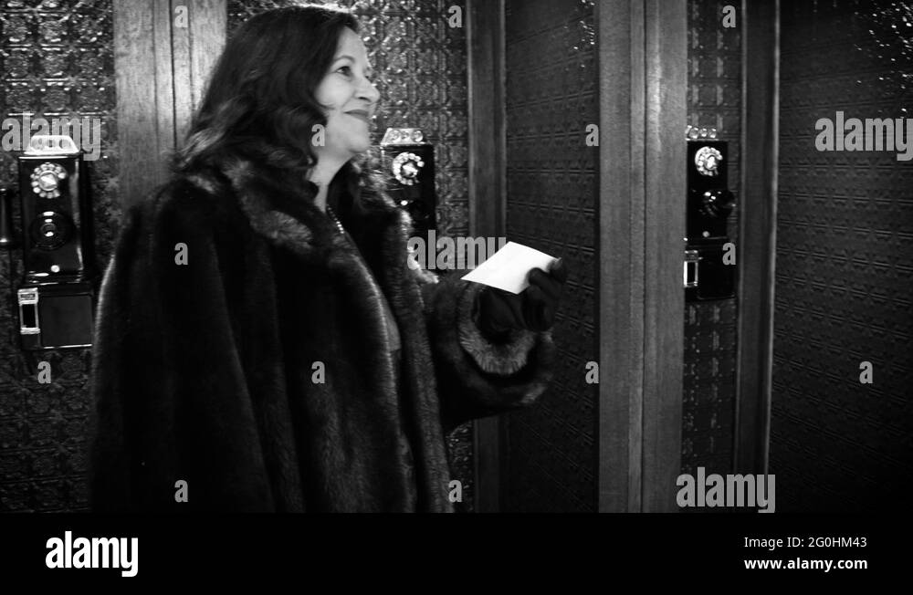 1930s woman watching for something next to phone booth 4k Stock Video ...