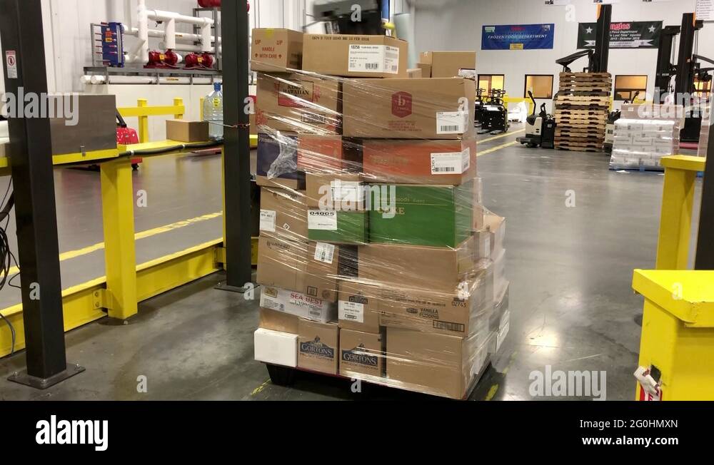 Wrapping commercial goods on pallet for truck transport Stock Video ...