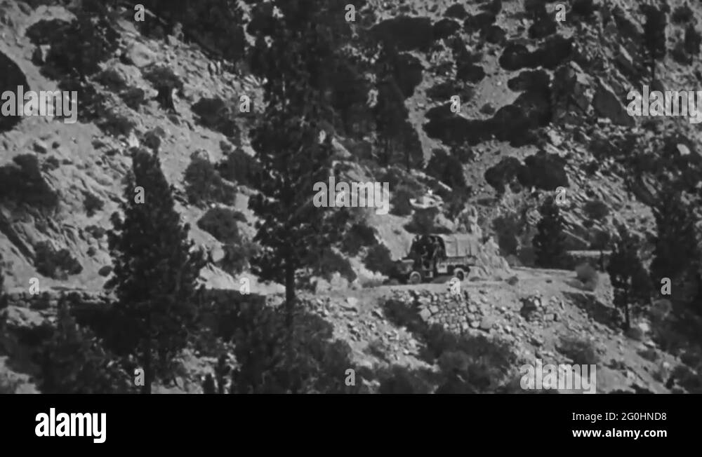 Military truck rounds a curve in the mountain - 1919 Stock Video ...