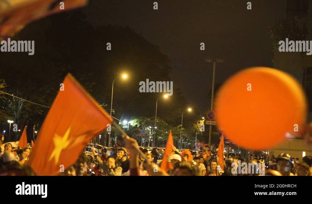 Massive crowd of celebrating football fans in the streets in slow ...