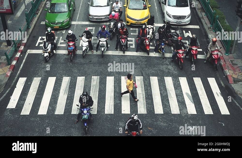 Woman crossing road Stock Videos & Footage - HD and 4K Video Clips - Alamy