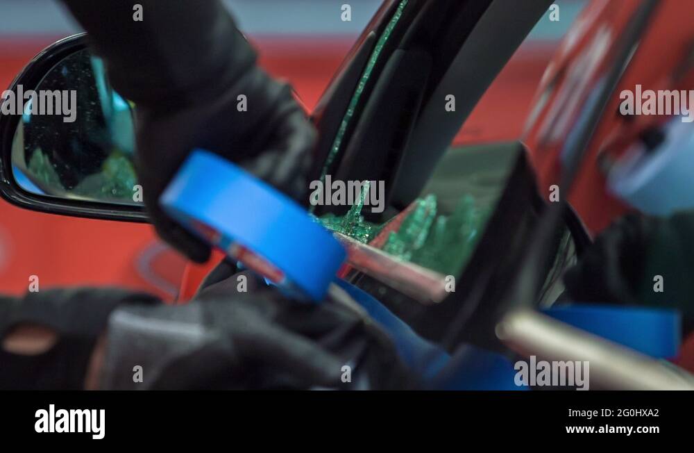 Putting a blue tape under a car window on the car Stock Video Footage ...