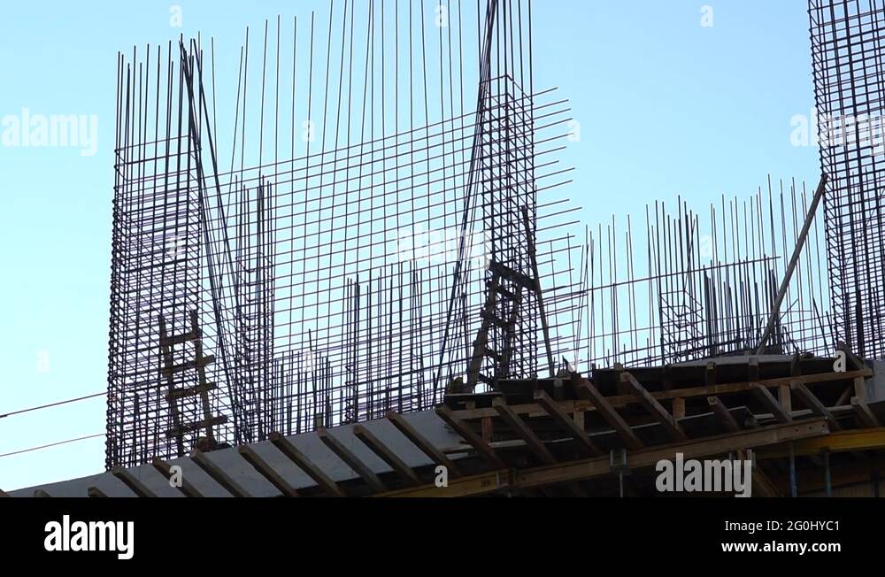 Construction industry workers working on building concrete structure ...
