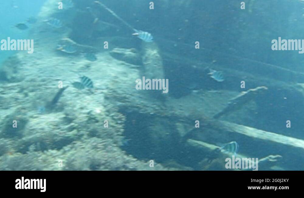 Point of view scuba diving footage of a sunken structure underwater ...