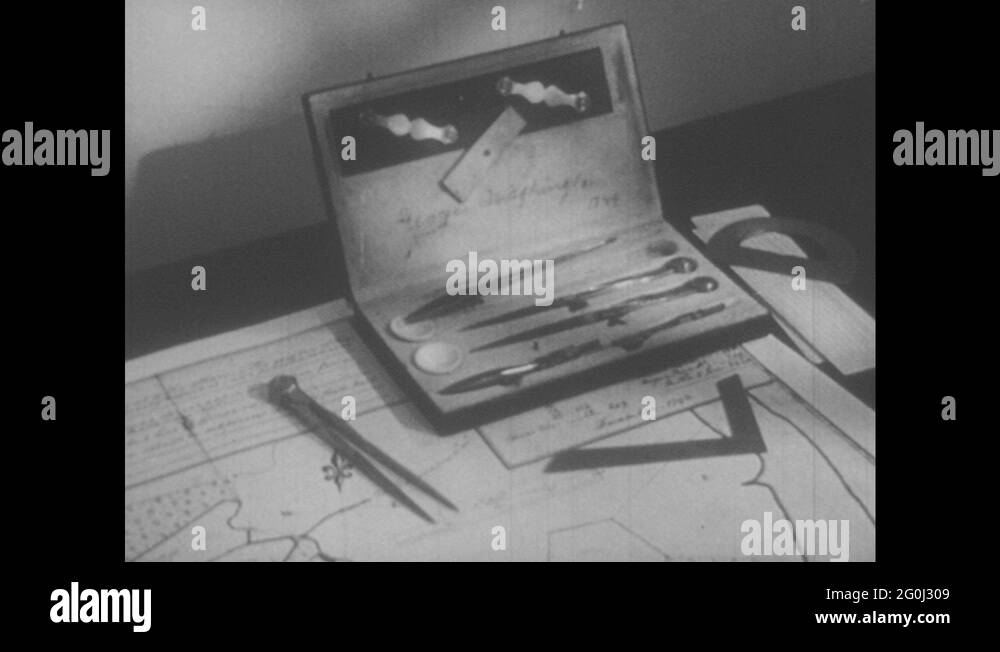 1950s: Colonial drafting supplies and compose on table. Illustrated map ...