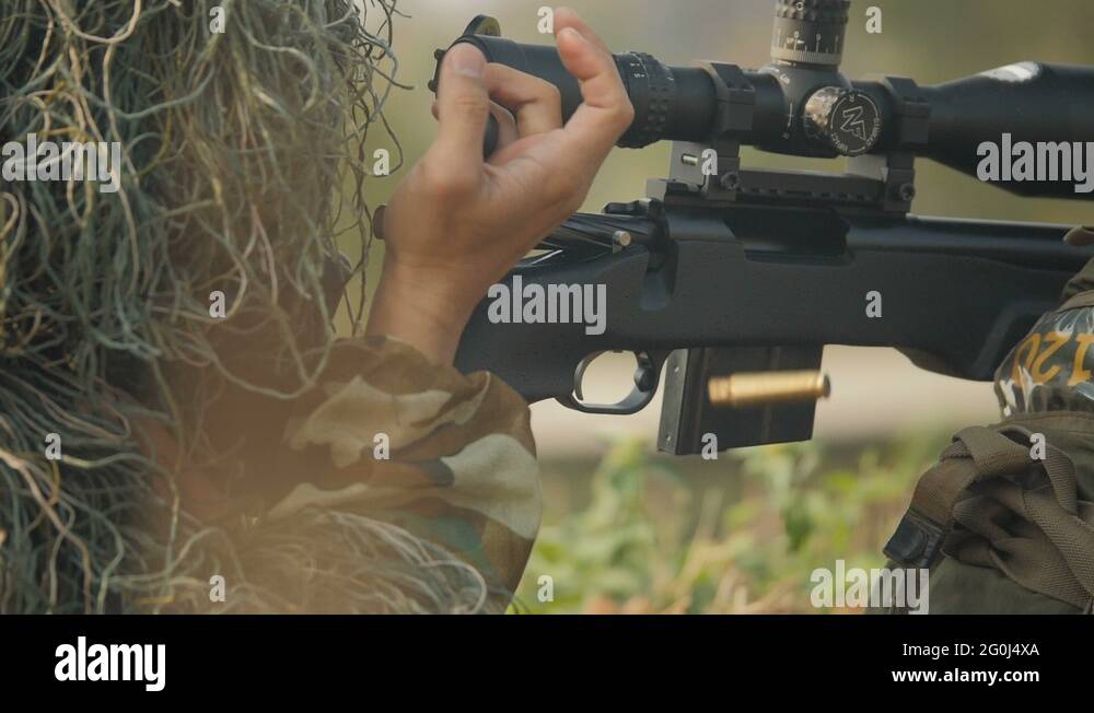 Army sniper reload his rifle Stock Video Footage - Alamy