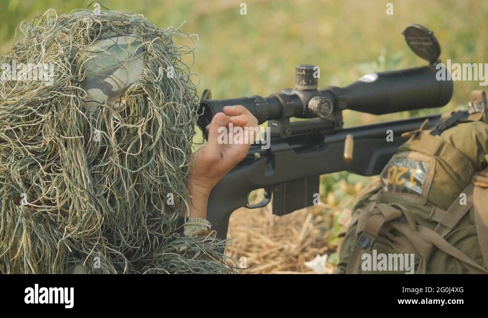 Army sniper reload his rifle Stock Video Footage - Alamy