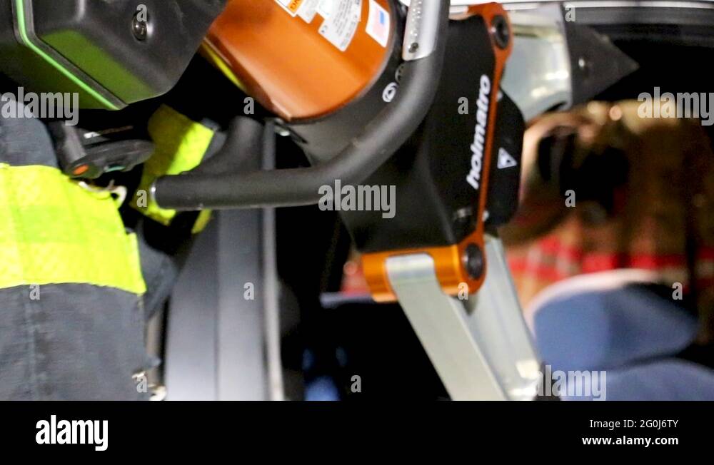 Firefighter Prying Open Car Door for Search and Rescue Car Accident ...