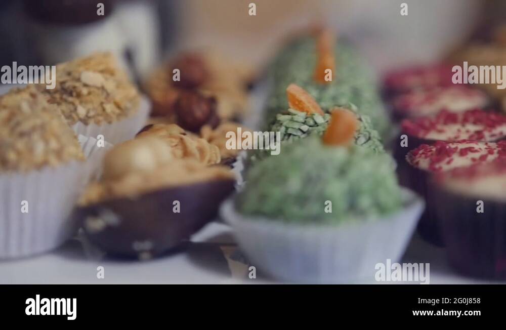 Rows of various sweets in the store, with a blur in the background. HD ...