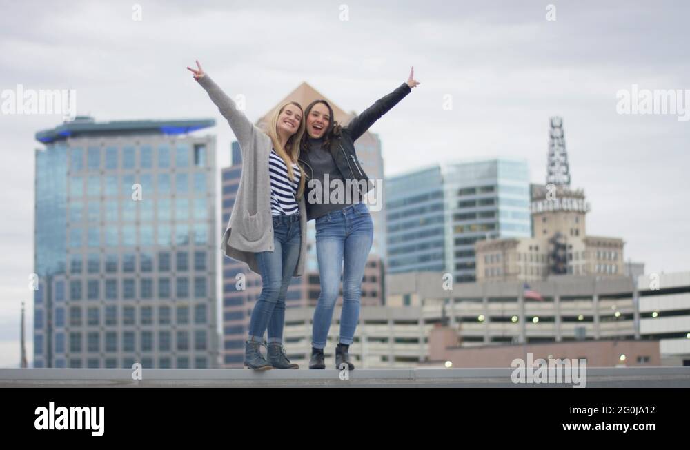 Fearless Friends Pose, With Peace Signs And Rock On Signs, On Rooftop ...