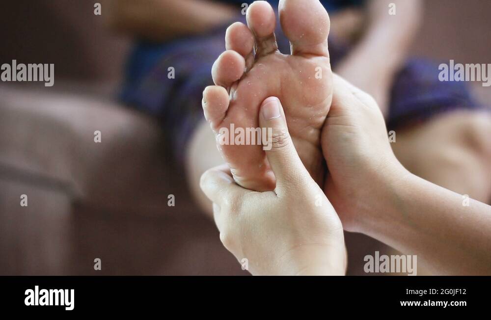 Woman touch foot Stock Videos & Footage - HD and 4K Video Clips - Alamy
