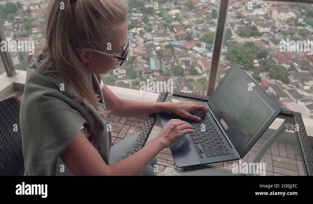Female freelancer working on terrace Stock Videos & Footage - HD and 4K ...