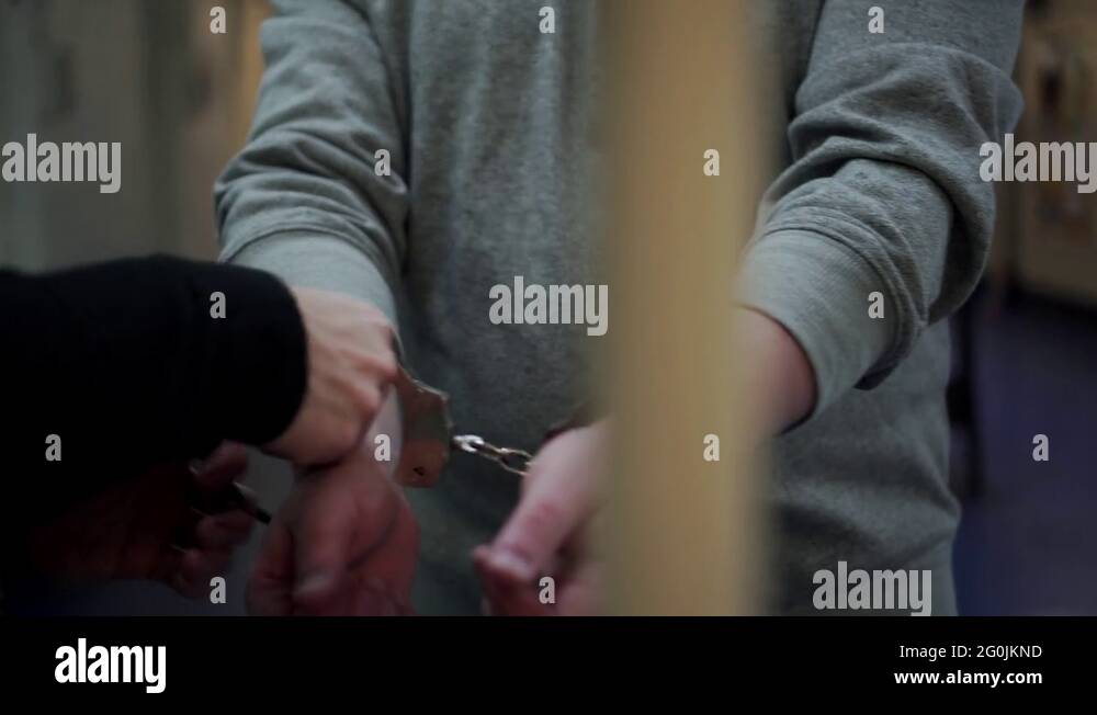 Prison Guard Puts Handcuffs On Inmate, 4K Crime, Prisoner Incarceration ...