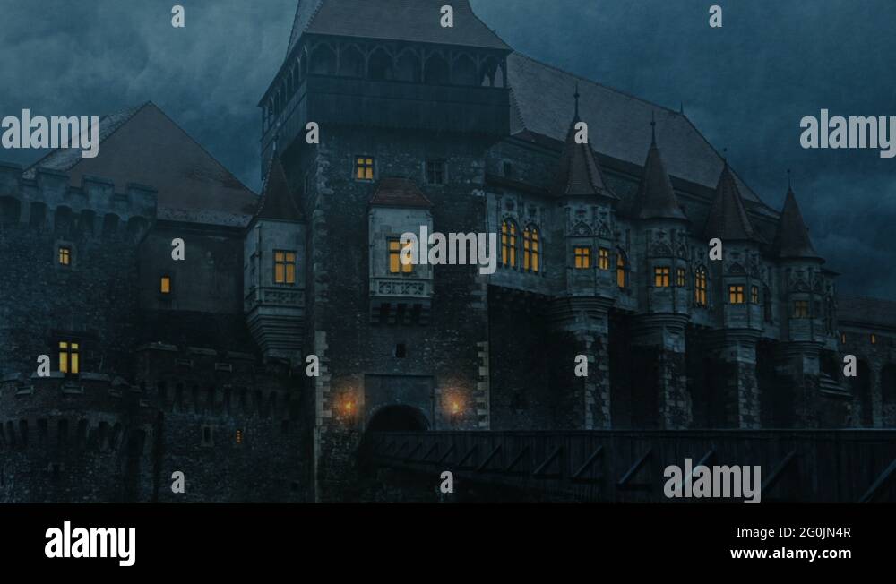 Corvin Castle in Transylvania on a stormy night - facade Stock Video ...