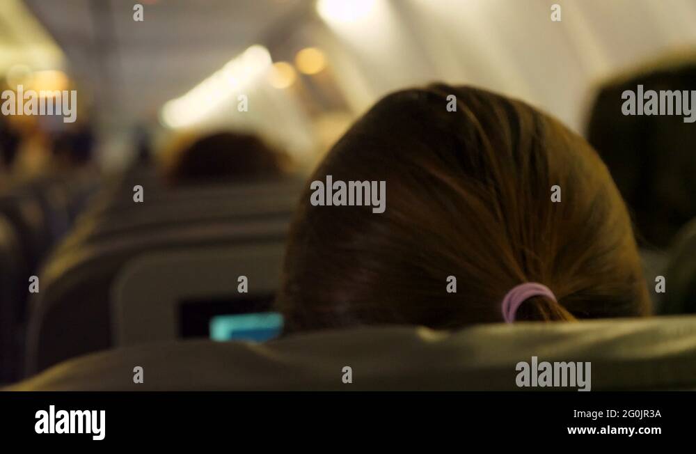 Passengers flying on a crowded airplane while travelling Stock Video ...