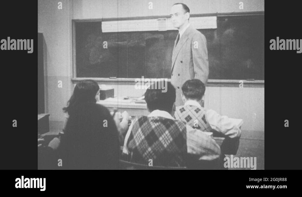 1940s: Teacher gives students angry look. Teacher shakes his head and ...