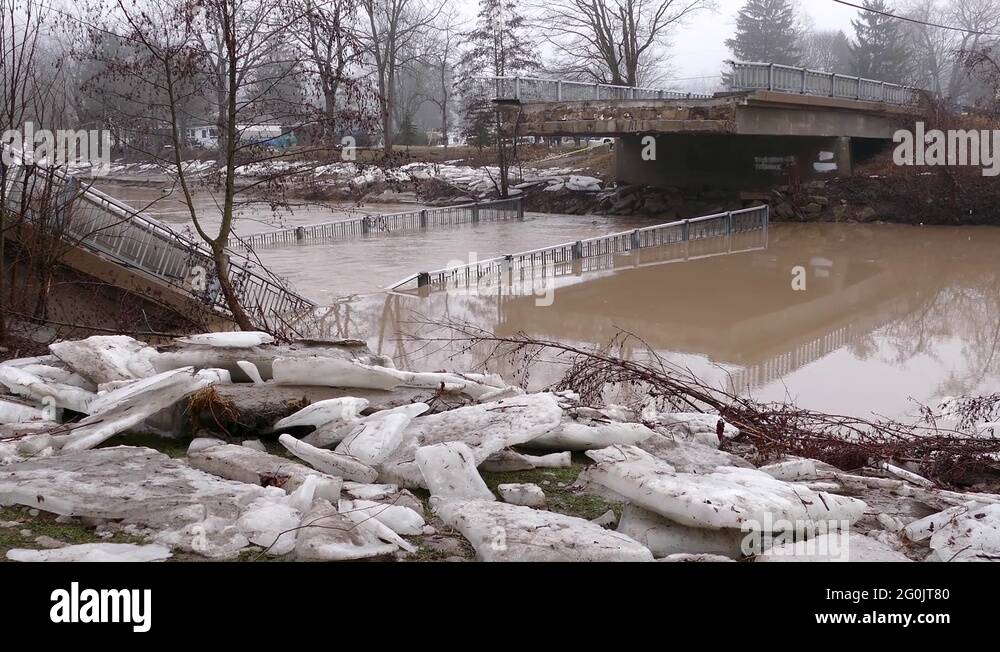 Bridge collapses into river during severe storm and flash flooding ...