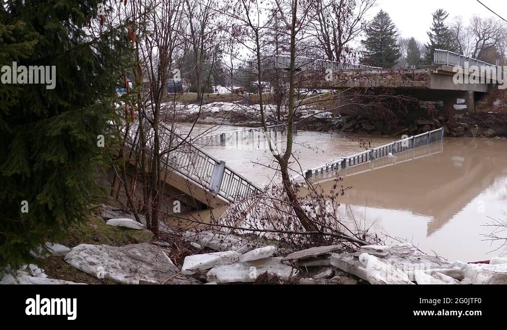 Bridge collapses into river during severe storm and flash flooding ...
