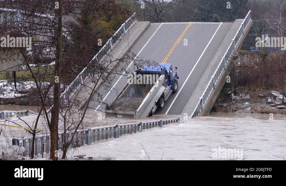 Bridge collapses into river during severe storm and flash flooding ...