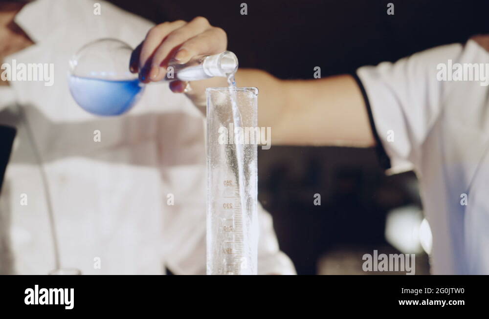 Technician mixing two chemical substances liquid Stock Videos & Footage ...