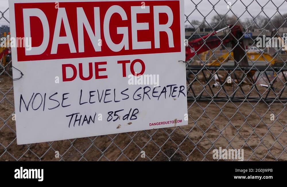Loud noise warning signs at construction site Stock Video Footage - Alamy