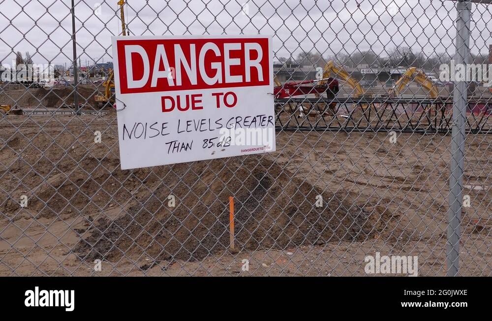 Loud noise warning signs at construction site Stock Video Footage - Alamy