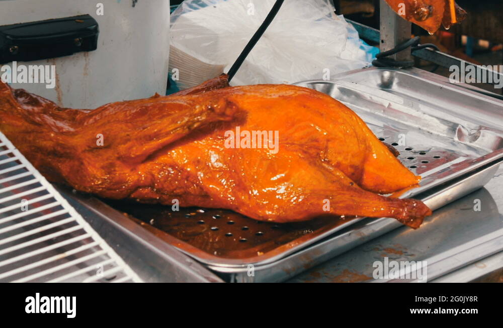 Street food in Thailand and Asia. Red Peking duck on counter. Exotic ...