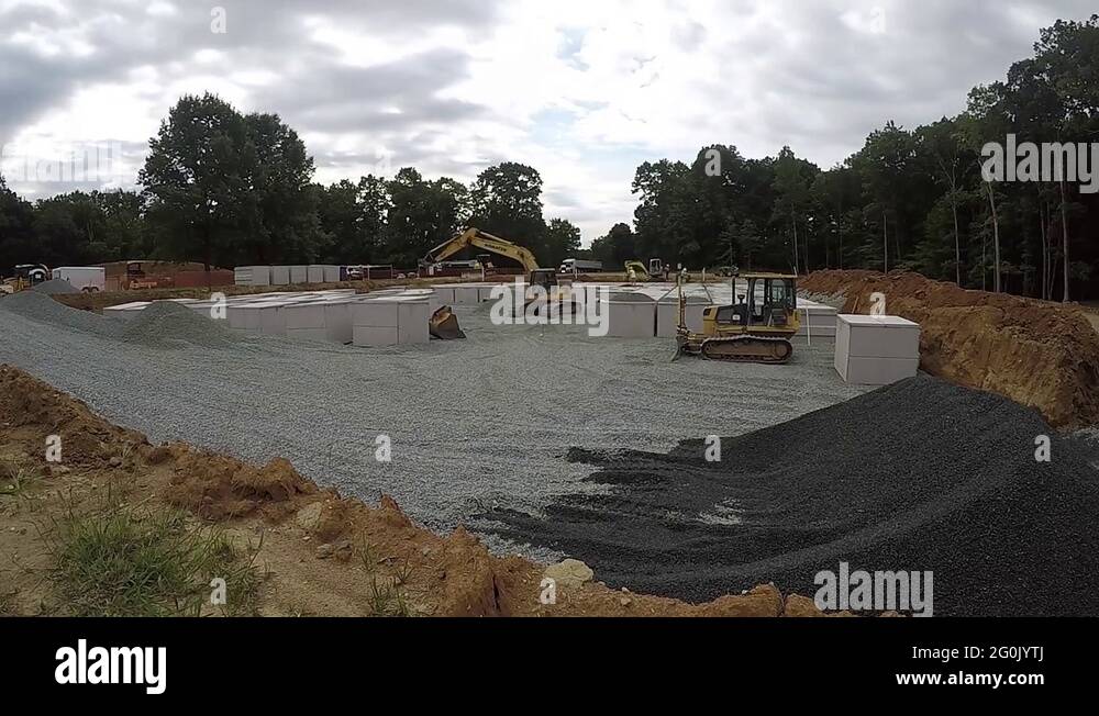 Crews installing pre-cast concrete crypts at Quantico National Cemetery ...