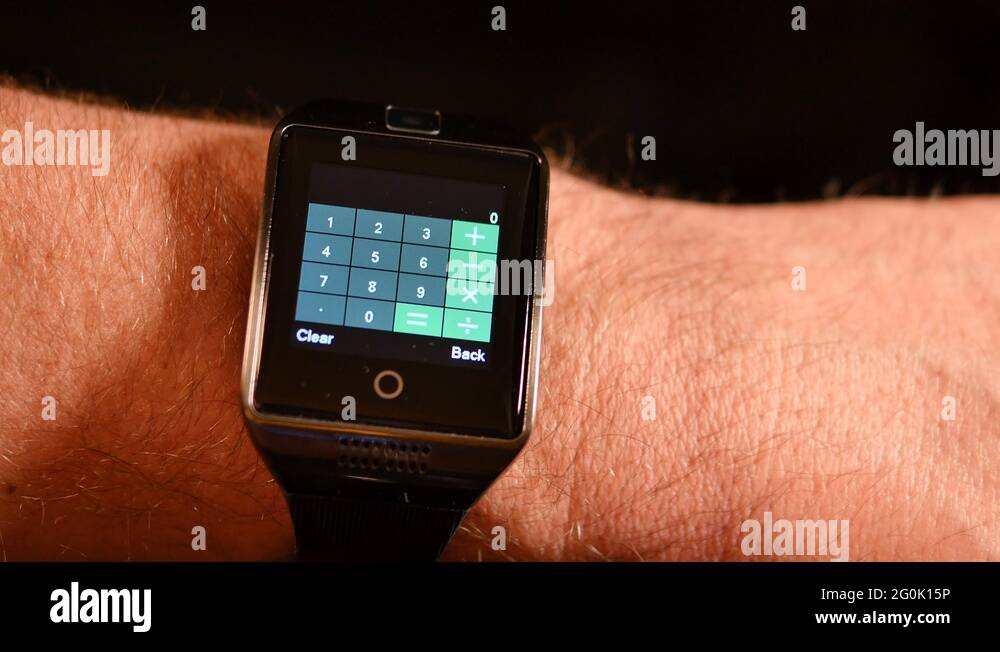 Smartwatch on male wrist using the calculator black background Stock ...