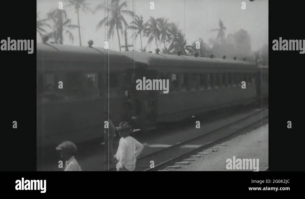 Passenger train with loaded wagons leaves the station - 1929 Stock ...