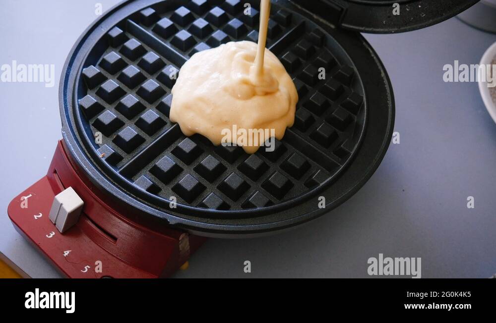 Girl Pouring Waffle Batter into a Waffle Maker in 4k Stock Video ...