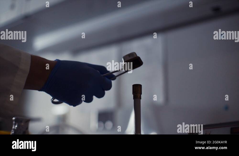 scientist lighting a bunsen burner on a scientific laboratory Stock ...