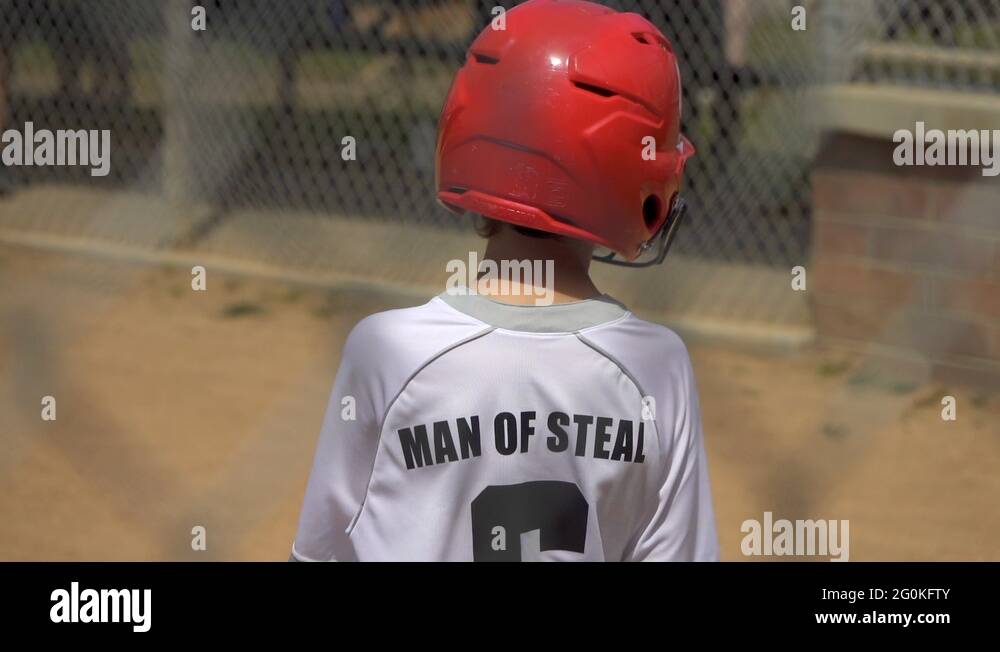 Boy at bat and batting in a little league baseball game, super slow ...