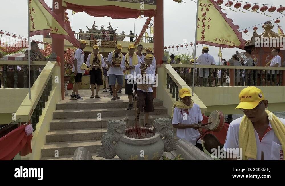 Staff carry statue deities and round the temple Stock Video Footage - Alamy