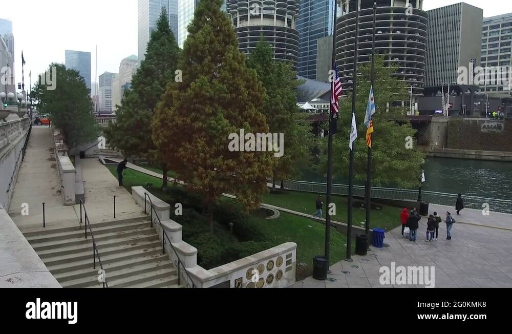 Flags And People Near Trees In City - Slide And Pan - Right To Left ...