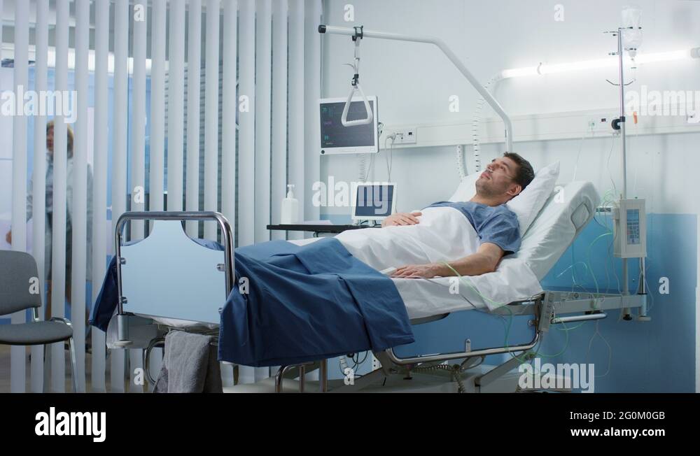 Sick Male Patient Lying on a Bed in the Private Ward in Hospital Stock ...