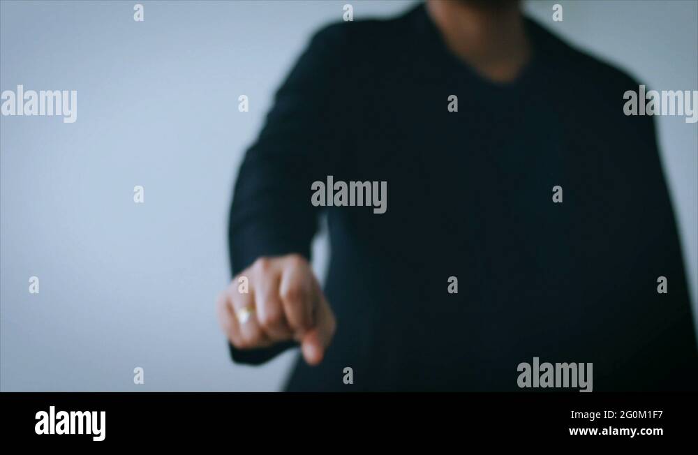 Hand of business woman pointing at UI world map with user interface ...
