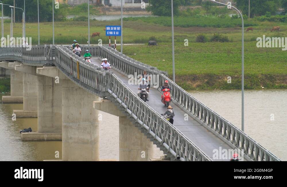 Mopeds Pass Over a Narrow Bridge in Hoi An Vietnam Stock Video Footage ...