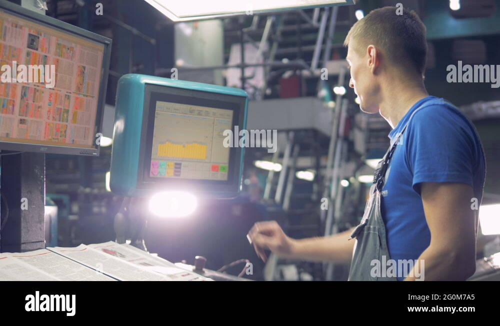 Worker using touchscreen operating industrial machine Stock Video ...
