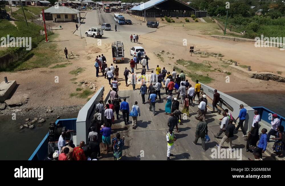 Crowd Leaving Ferry In Mwanza, Tanzania, Africa, Commuters To Work ...