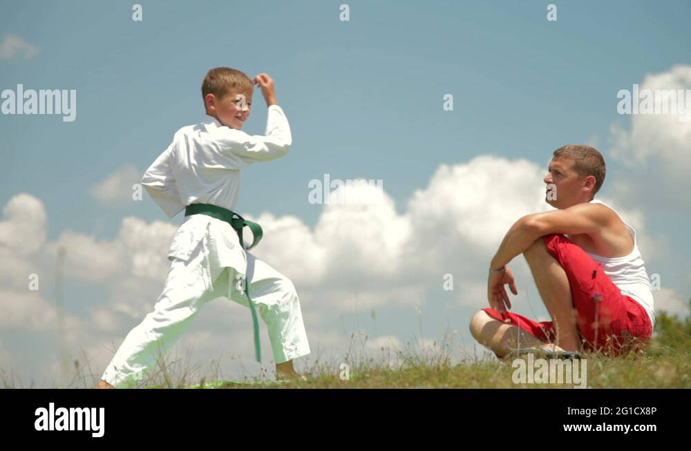 son and father practicing karate Stock Video Footage - Alamy