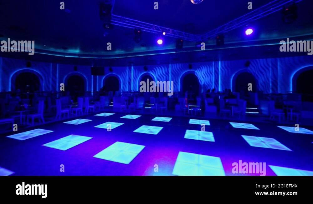 People sit at tables in night club with dance floor Stock Video Footage ...