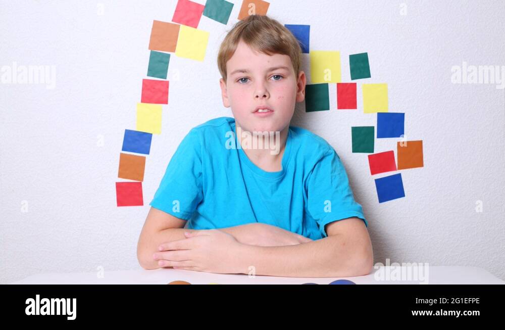 Colored pieces of paper moving around a boy. Stop motion Stock Video ...
