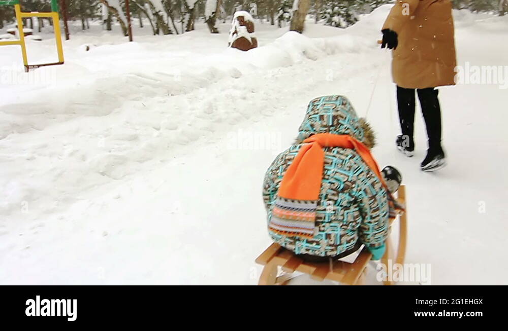 Boy pulling a sledge Stock Videos & Footage - HD and 4K Video Clips - Alamy