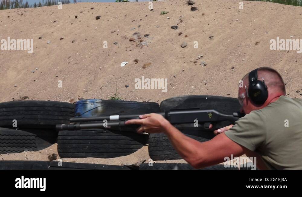 Man shooting rifle Stock Video Footage - Alamy