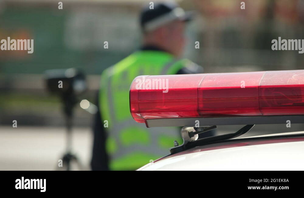 Police Officer Using Radar Speed Gun Stock Video Footage - Alamy