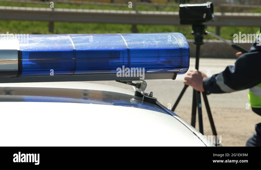 Police Officer Using Radar Speed Gun Stock Video Footage - Alamy