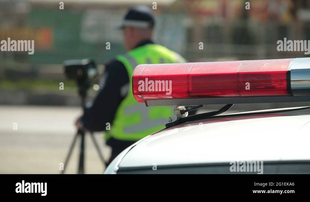 Police Officer Using Radar Speed Gun Stock Video Footage - Alamy