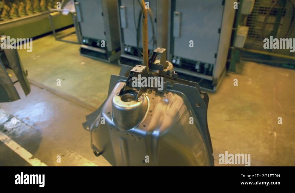 Conveyor transporter moves car components at factory workshop Stock ...