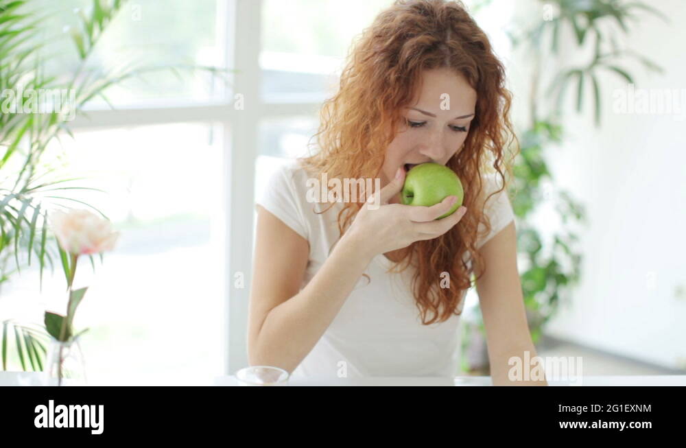 Pretty girl eating apple using Stock Videos & Footage - HD and 4K Video ...